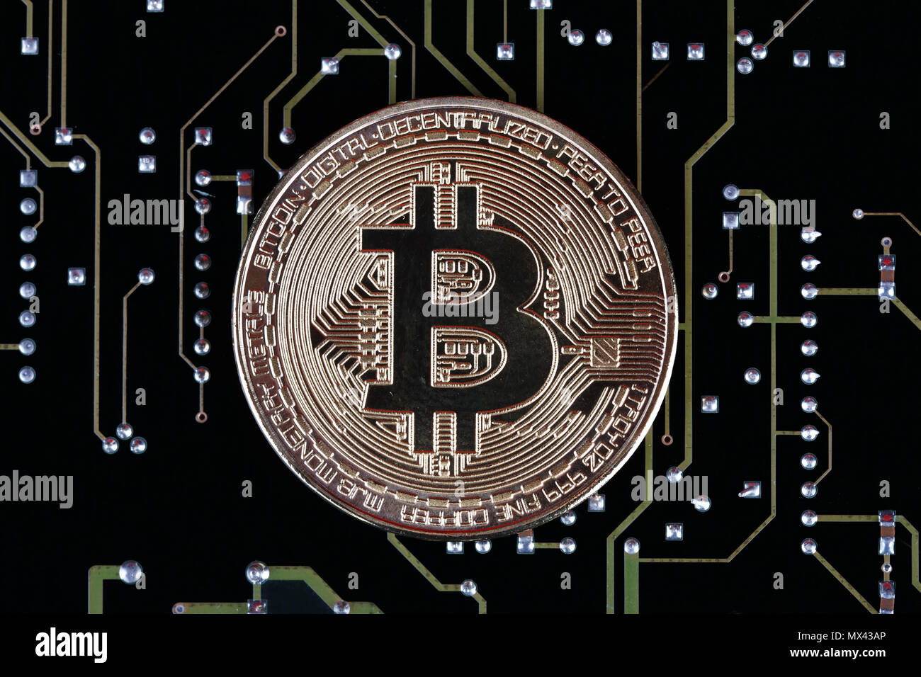 Bitcoin on printed circuit board Stock Photo - Alamy