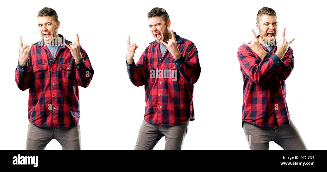 Young man making rock symbol with hands, shouting and celebrating ...