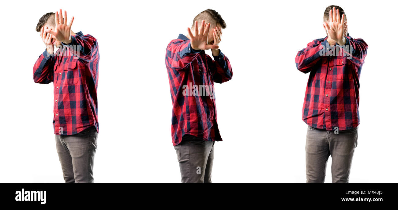 Young man stressful and shy keeping hand on head, tired and frustrated ...