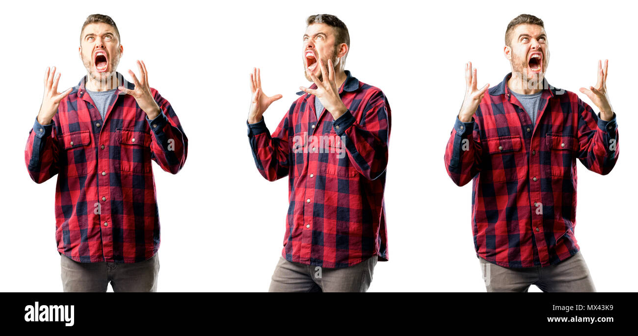 Young man terrified and nervous expressing anxiety and panic gesture ...