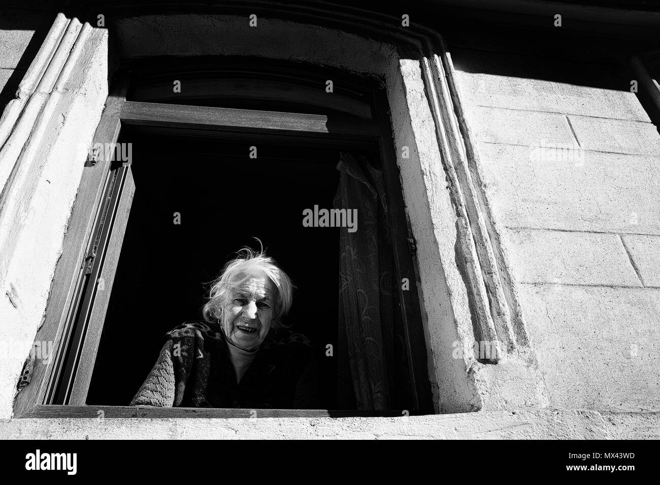 Woman behind window exterior Black and White Stock Photos & Images - Alamy