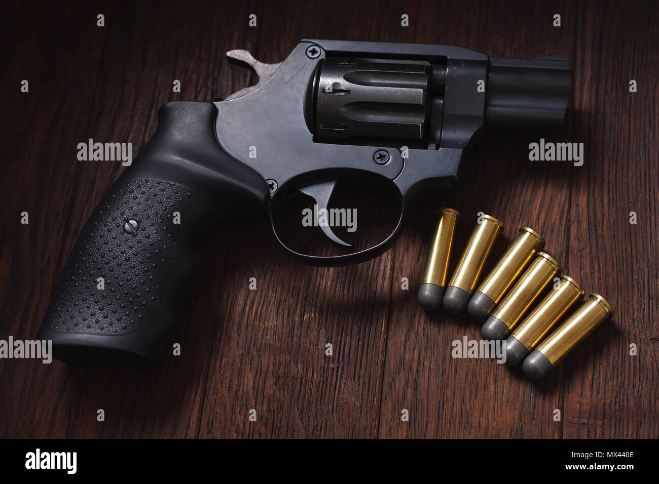 Revolver and cartridges on wood hi-res stock photography and images - Alamy