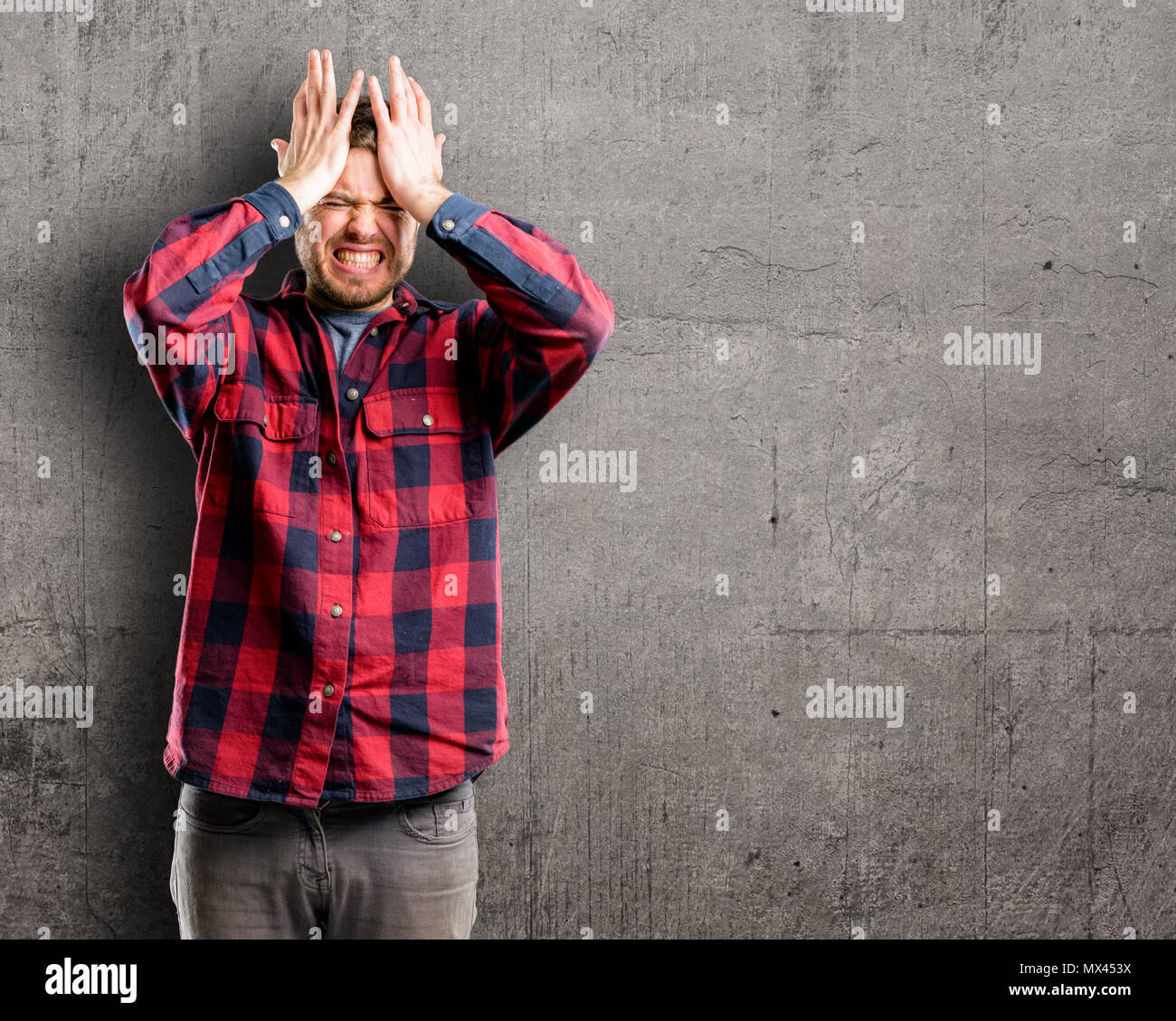 Young handsome man terrified and nervous expressing anxiety and panic ...