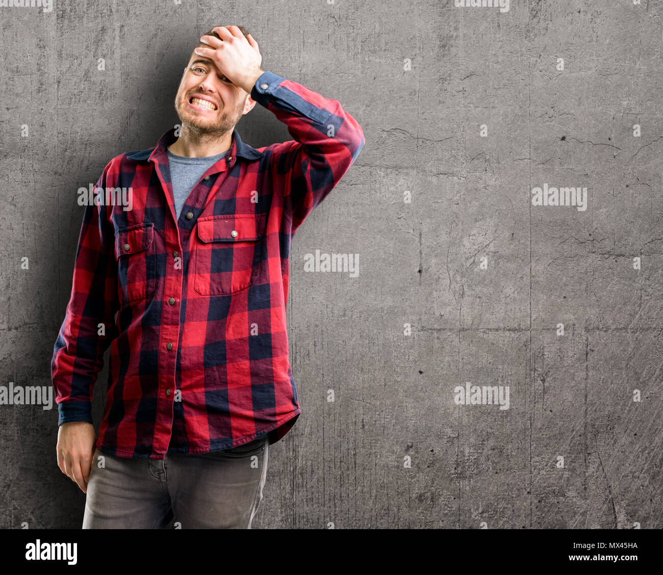 Young handsome man terrified and nervous expressing anxiety and panic ...
