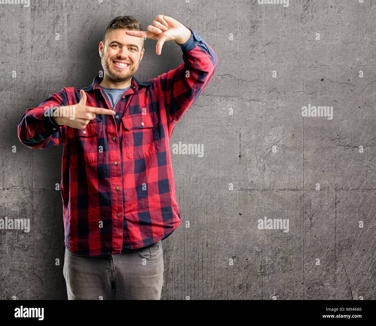 Young handsome man confident and happy showing hands to camera ...
