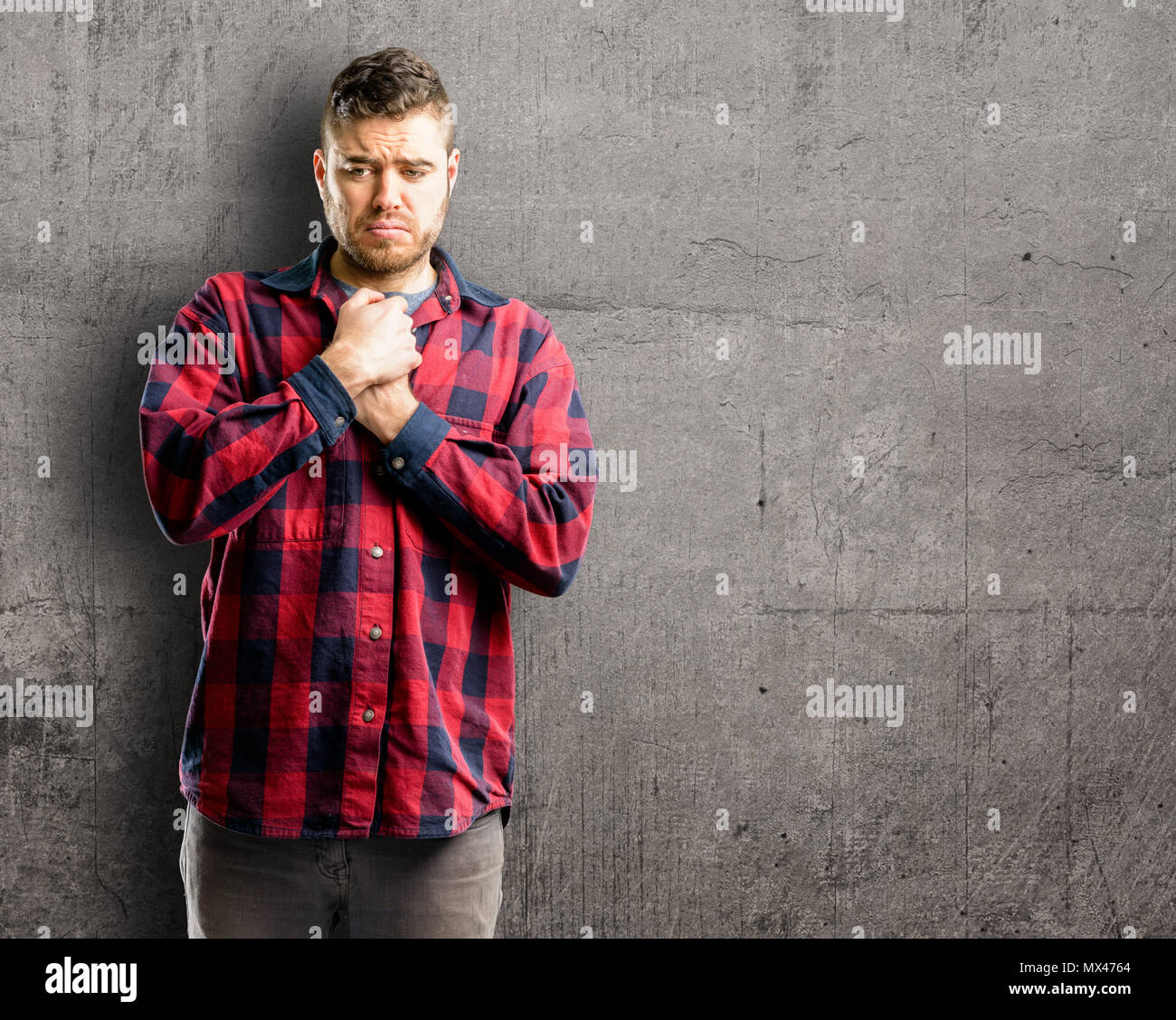 Young handsome man crying depressed full of sadness expressing sad ...