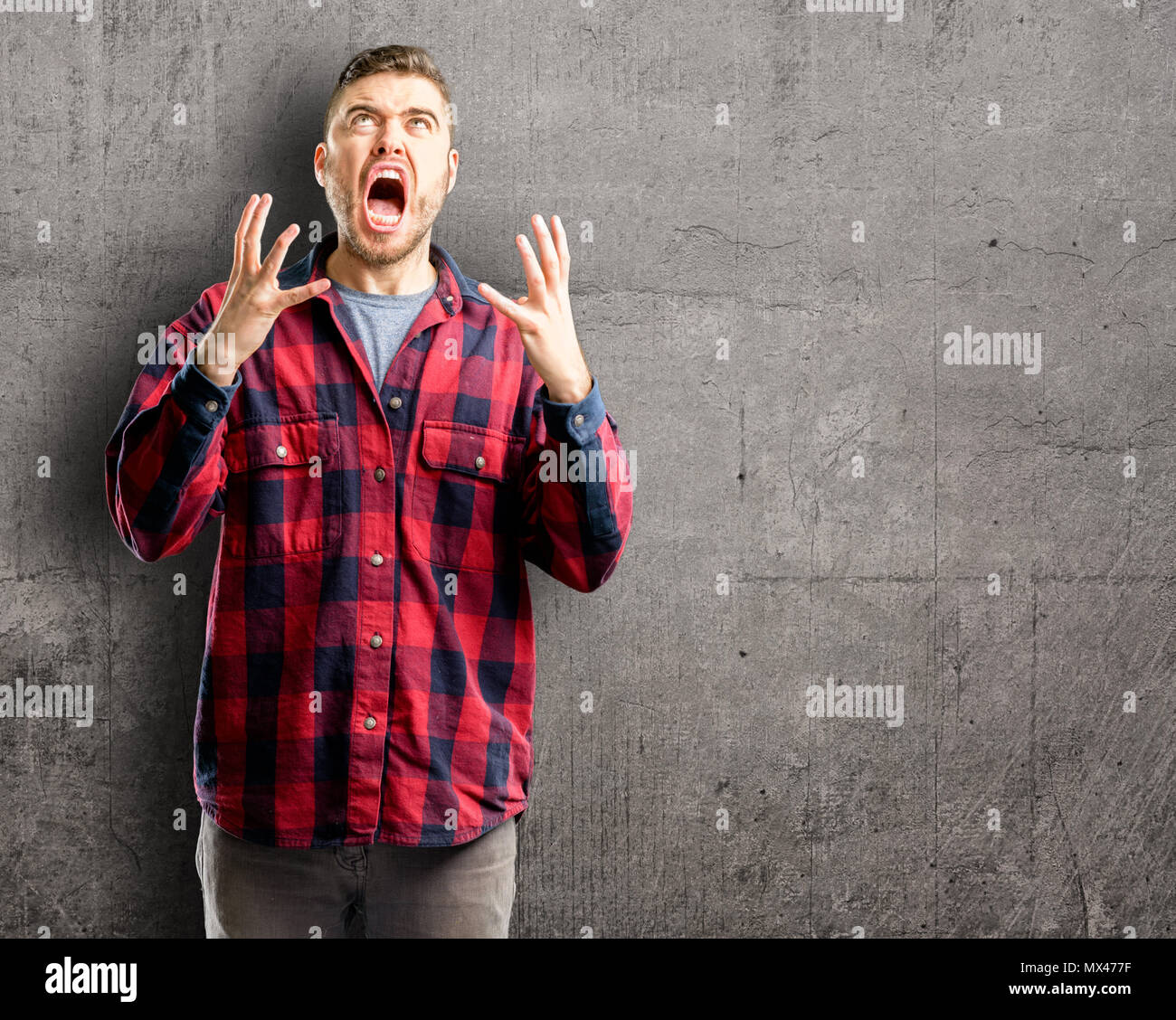 Young handsome man terrified and nervous expressing anxiety and panic ...