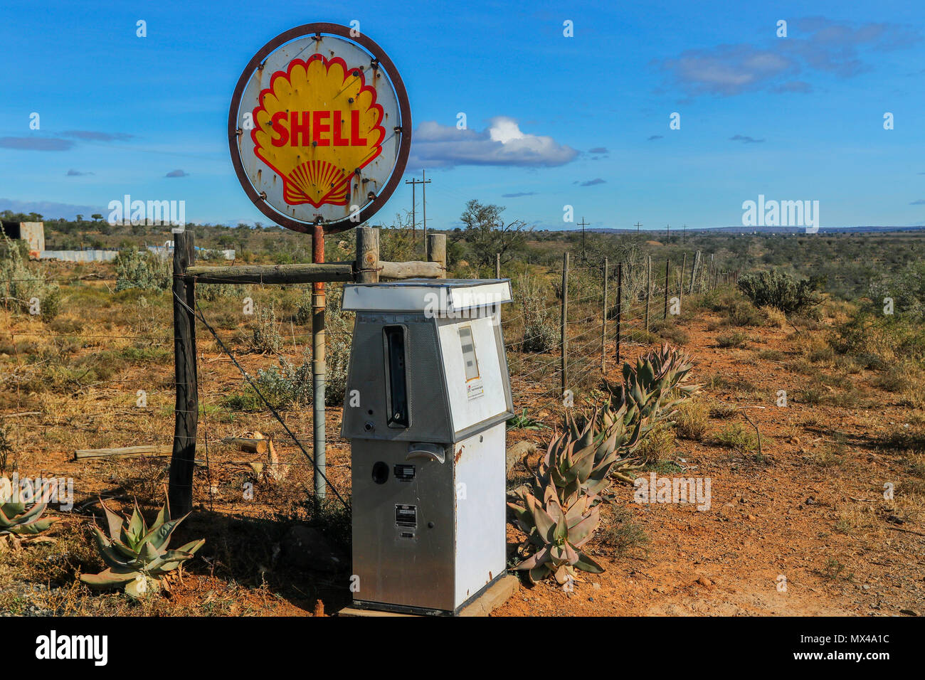 Shell petrol sign and pump on the edge of an unpaved road in the Addo ...