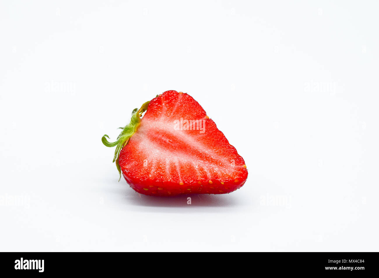 Slices of strawberry isolated on white background Stock Photo - Alamy