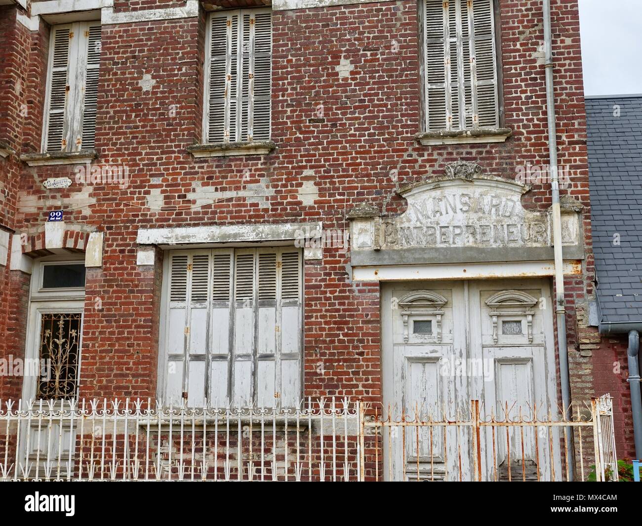 Old red brick building, with weathered features, Le Crotoy, France ...