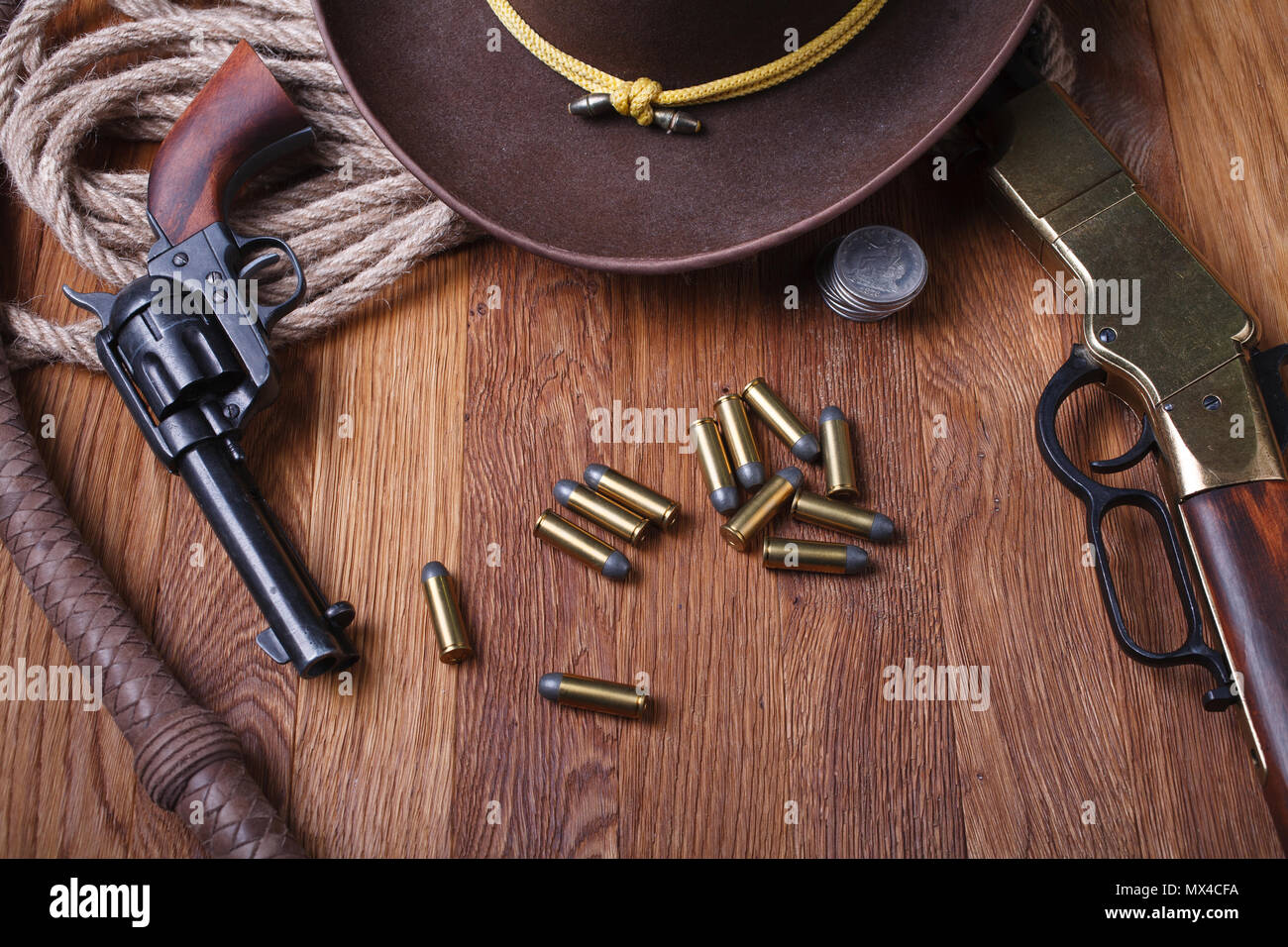 Wild west rifle, ammunition and sheriff badge on wooden table Stock ...