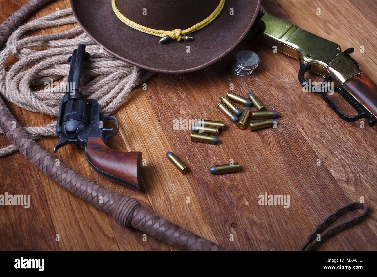 Wild west rifle, ammunition and sheriff badge on wooden table Stock ...