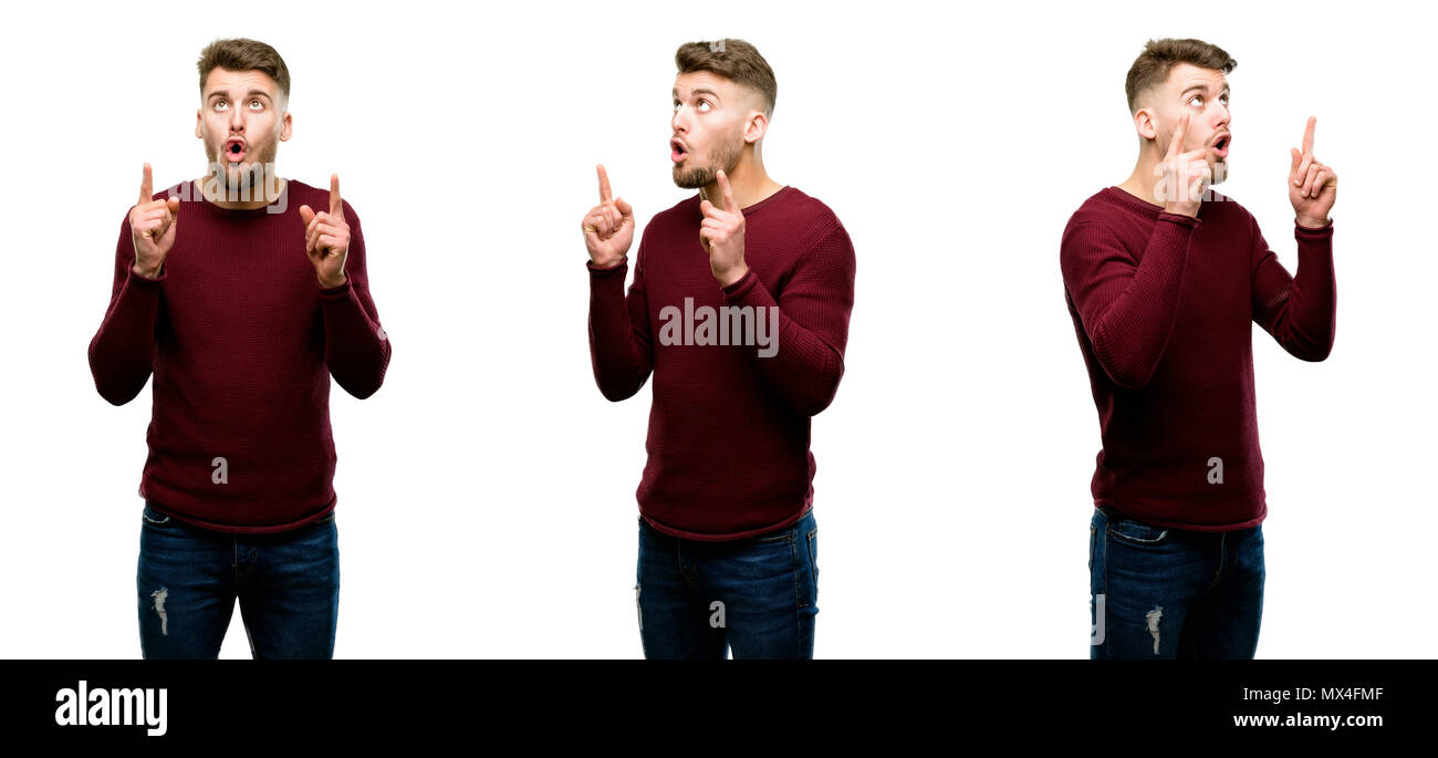 Handsome blond man happy and surprised cheering expressing wow gesture ...