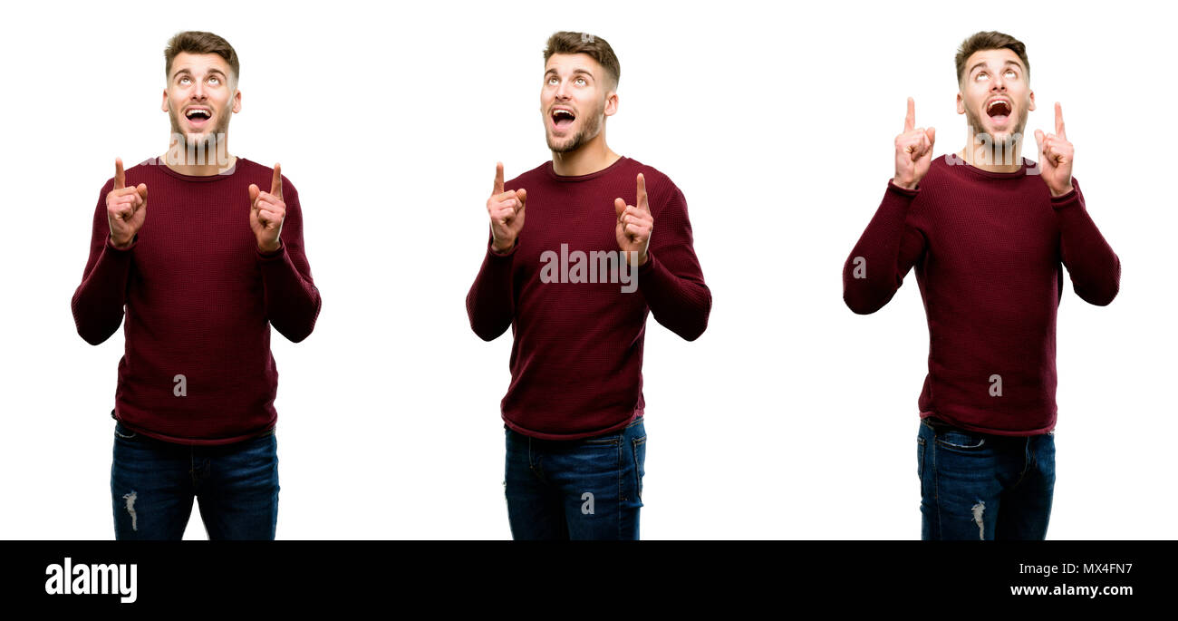 Handsome blond man happy and surprised cheering expressing wow gesture ...