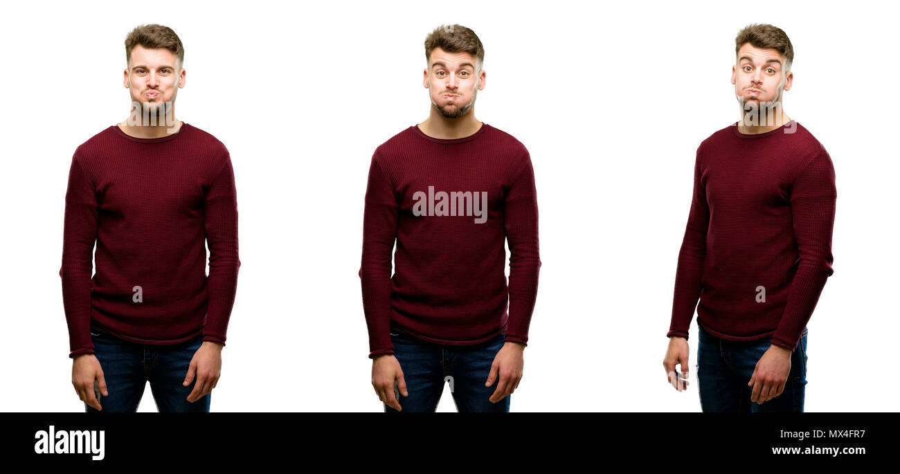 Handsome blond man puffing out cheeks, having fun making funny face ...