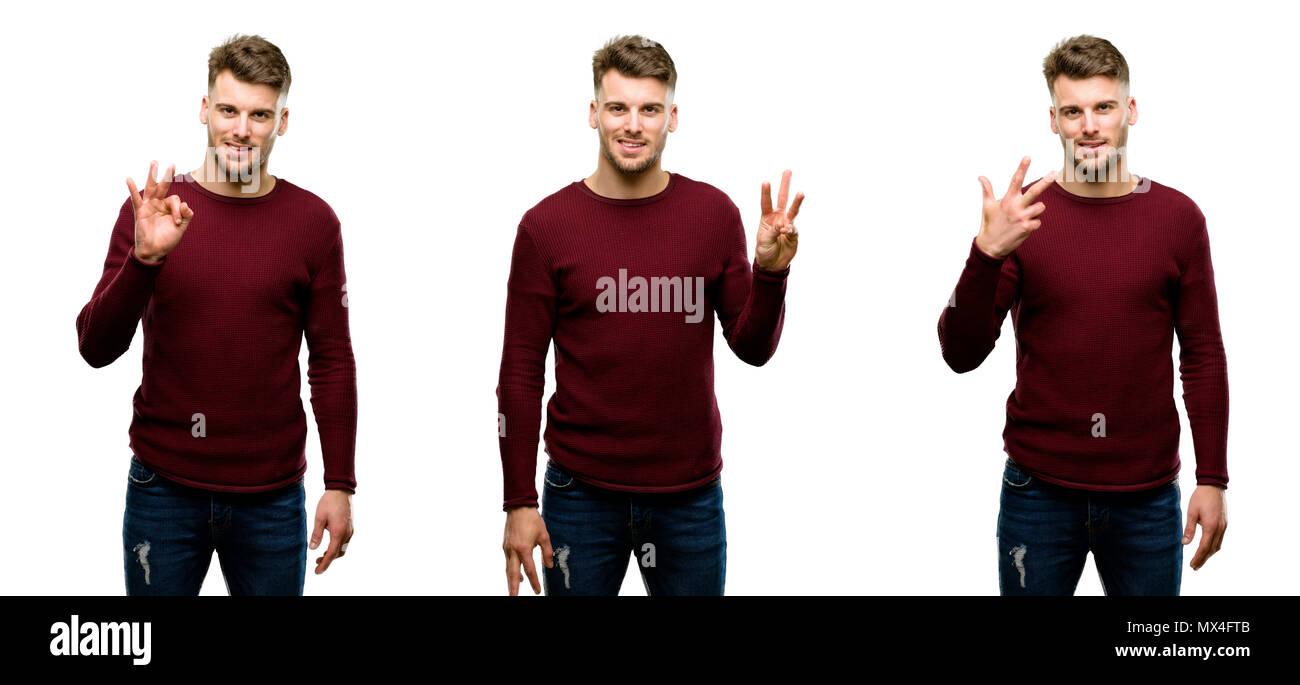 Handsome blond man raising his finger, is the number three isolated ...