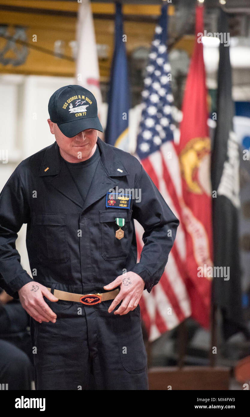 ARABIAN GULF (May 1, 2017) Ensign Christopher Helms puts on his new ...