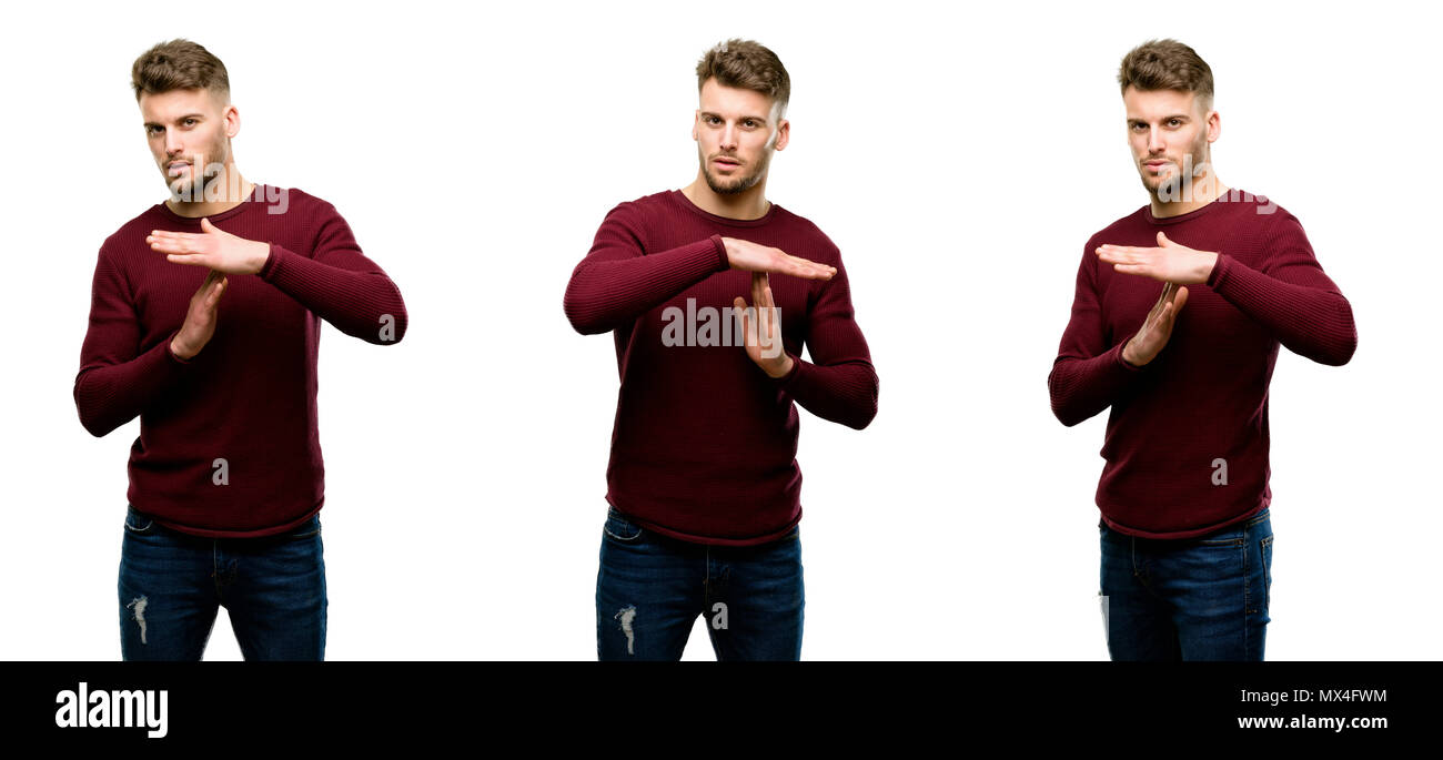 Handsome blond man serious making a time out gesture with hands ...