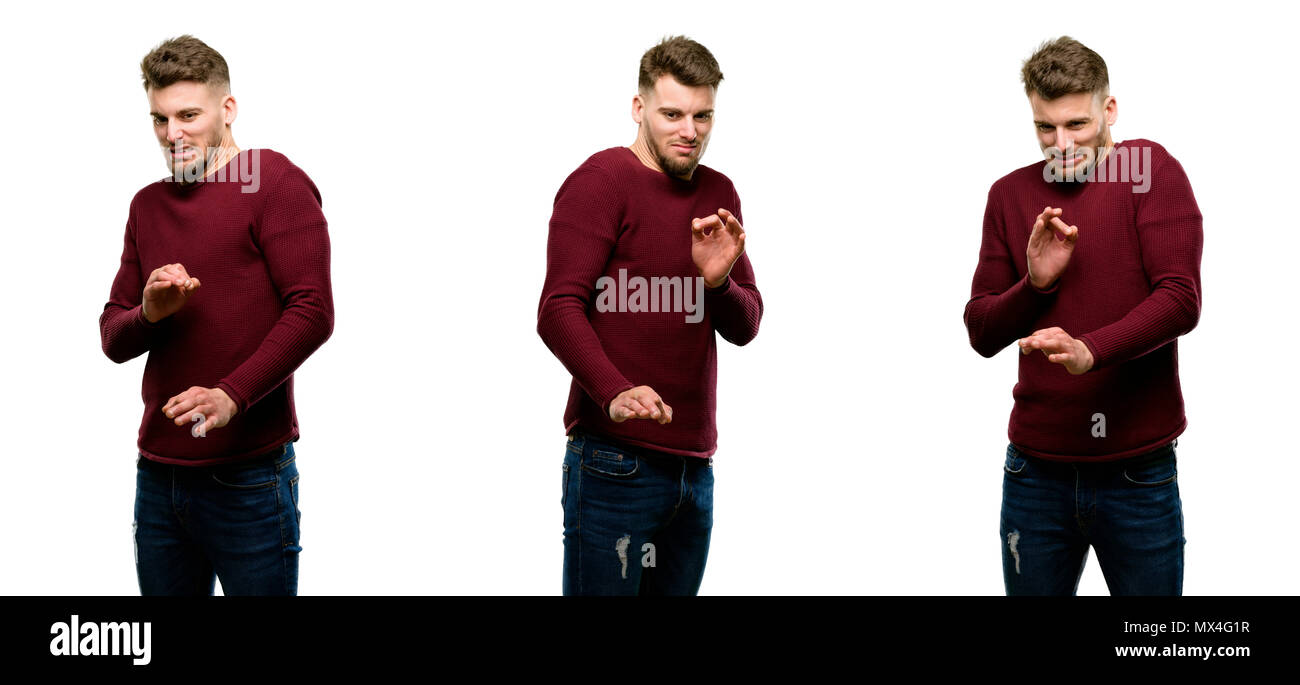 Handsome blond man disgusted and angry, keeping hands in stop gesture ...