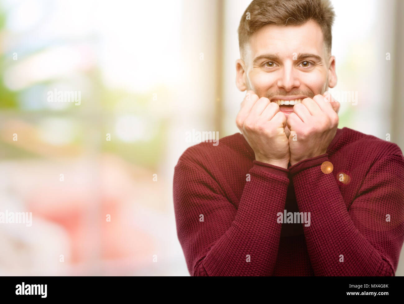 Handsome young man happy and surprised cheering expressing wow gesture ...