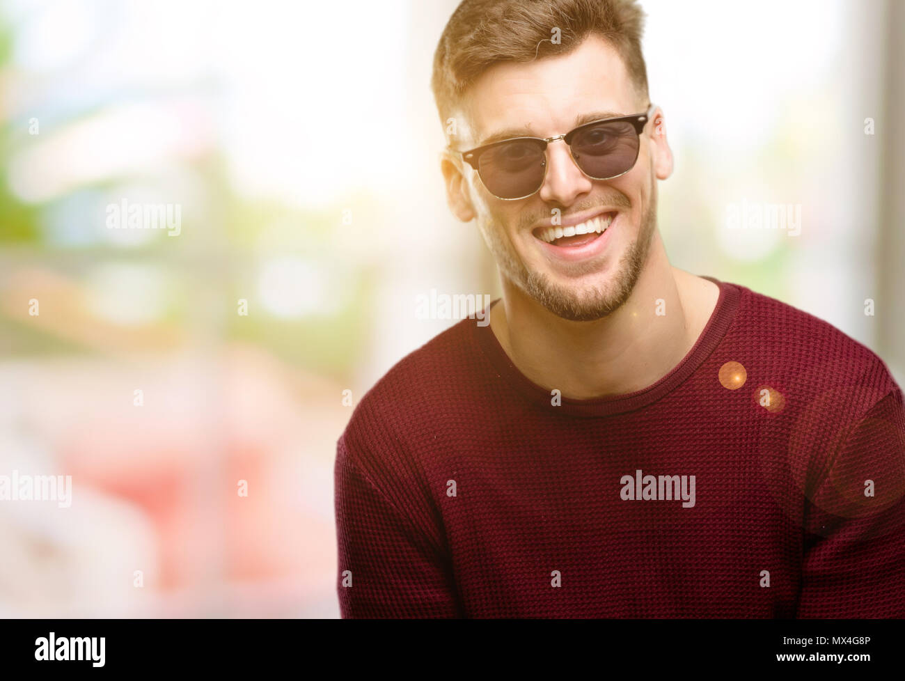 Handsome young man happy and surprised cheering expressing wow gesture ...