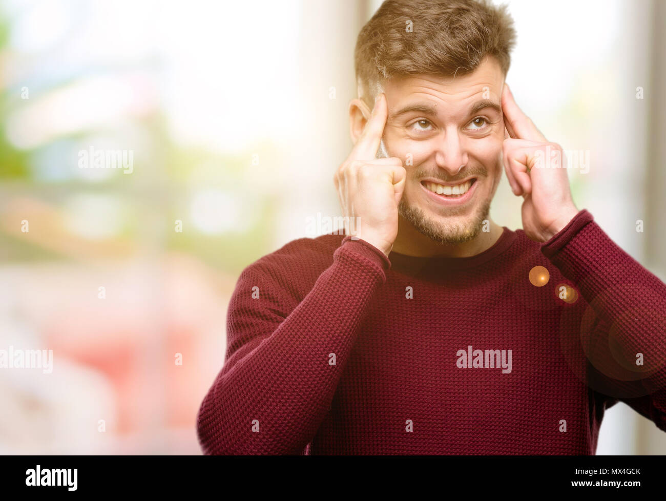 Handsome young man doubt expression, confuse and wonder concept ...