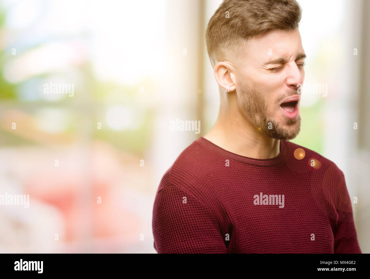 Handsome young man crying depressed full of sadness expressing sad ...
