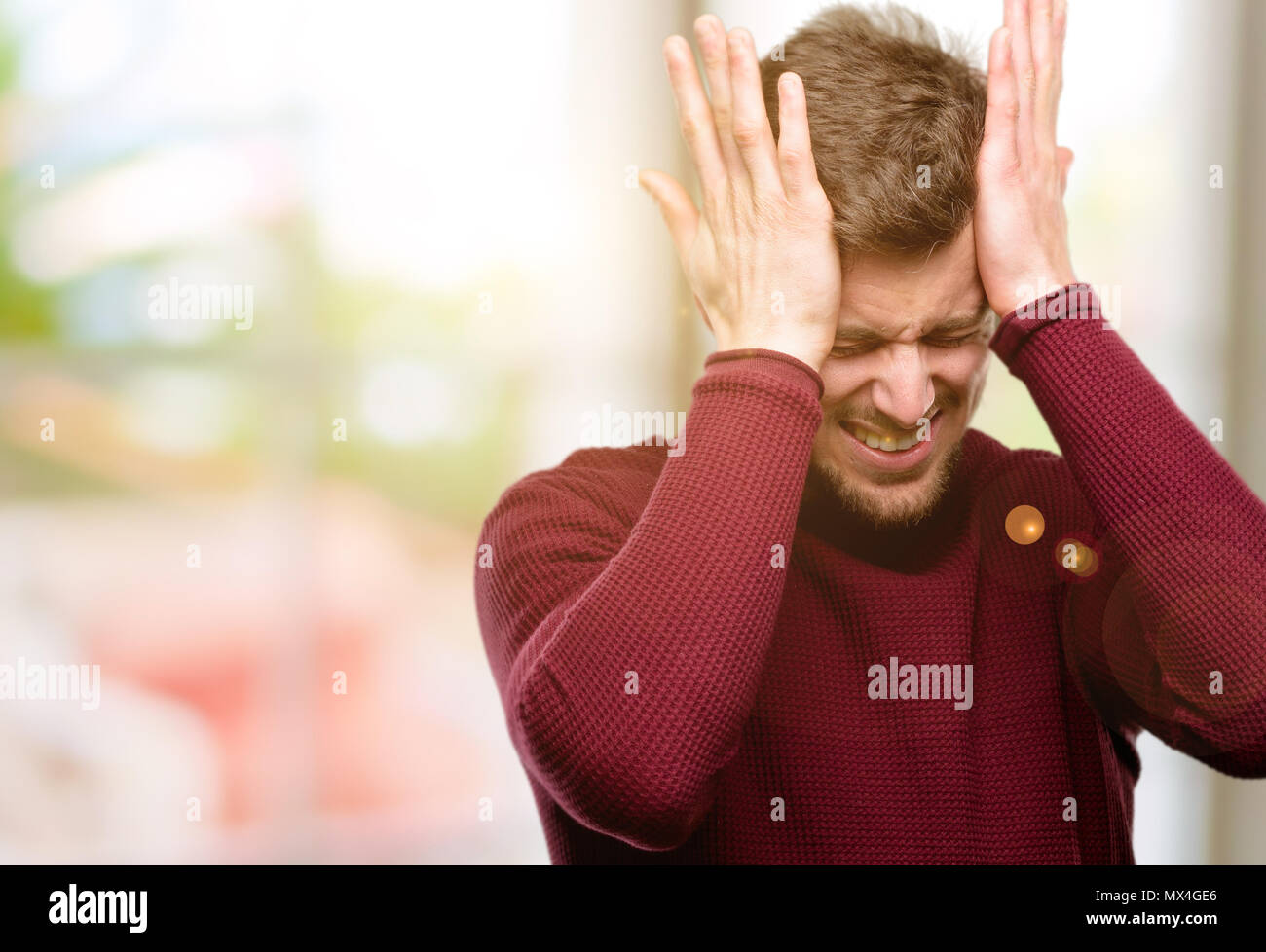 Handsome young man terrified and nervous expressing anxiety and panic ...
