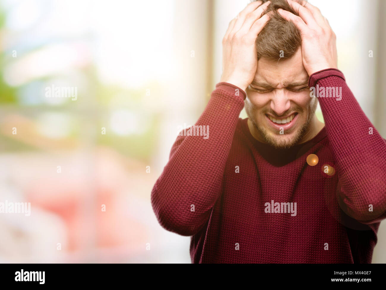Handsome young man terrified and nervous expressing anxiety and panic ...