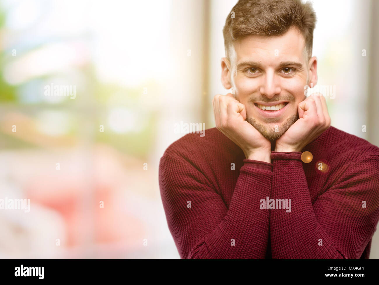 Handsome young man happy and surprised cheering expressing wow gesture ...