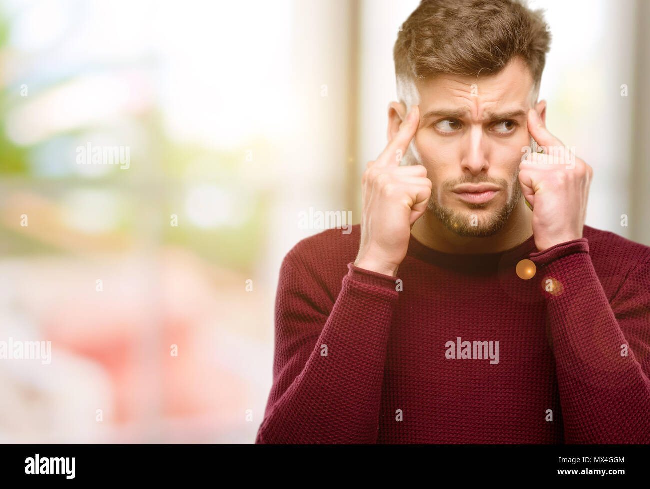 Handsome young man doubt expression, confuse and wonder concept ...