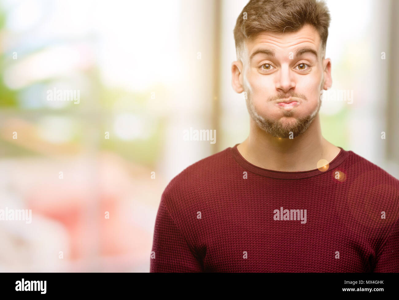 Puffing out cheeks hi-res stock photography and images - Alamy