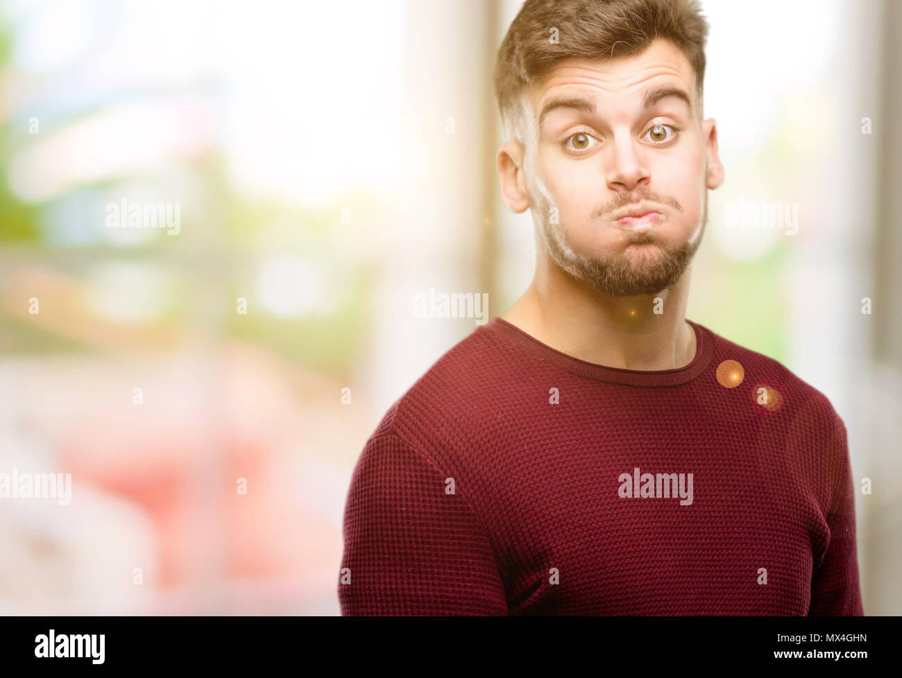 Puffing out cheeks hi-res stock photography and images - Alamy