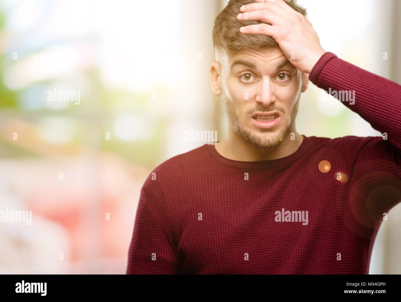 Handsome young man terrified and nervous expressing anxiety and panic ...