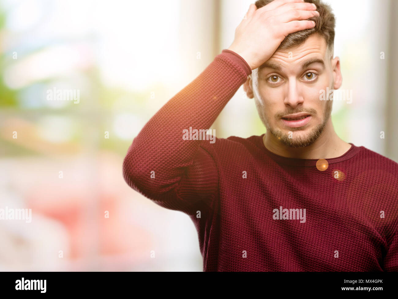 Handsome young man terrified and nervous expressing anxiety and panic ...