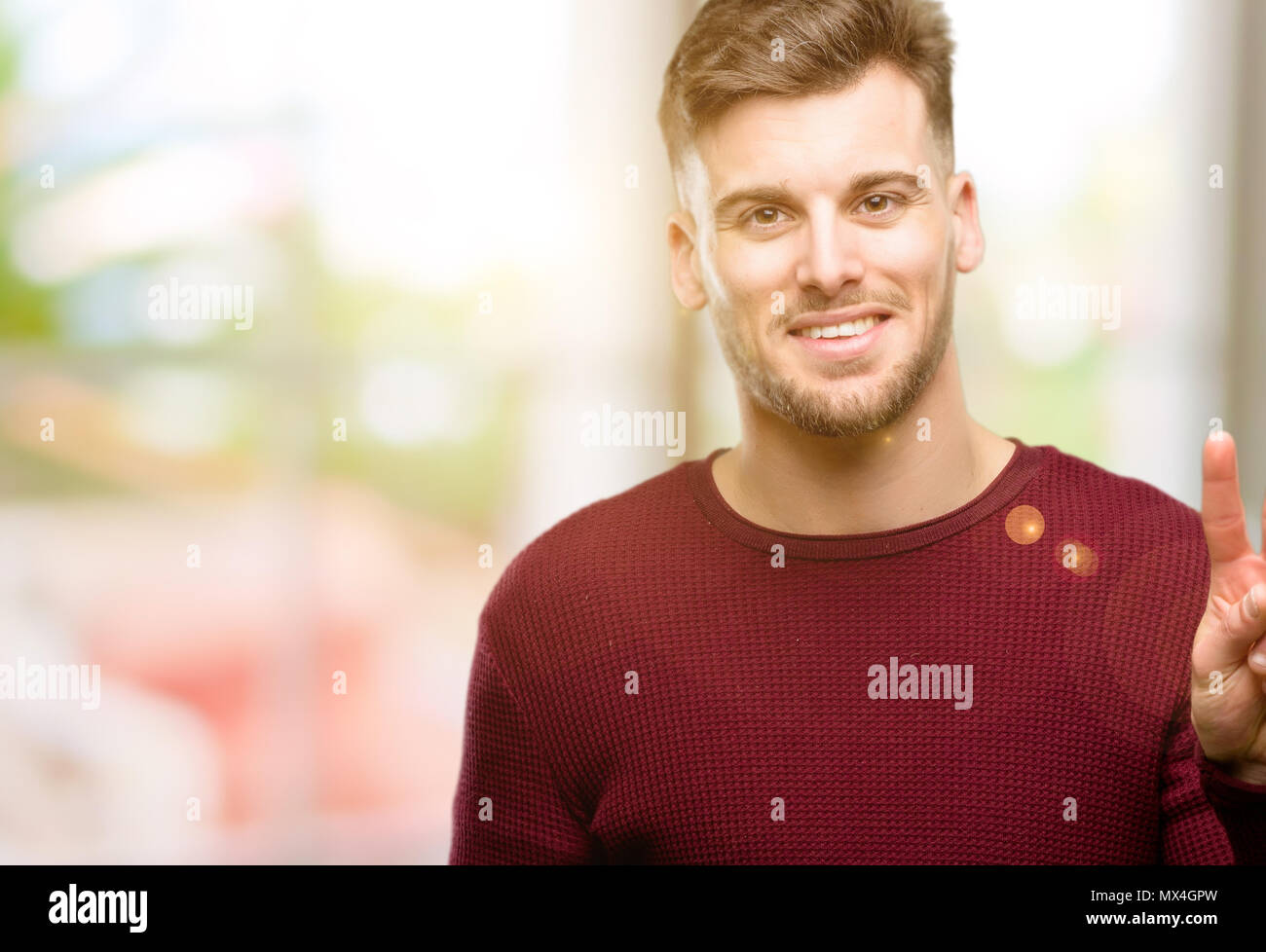 Raising two fingers hi-res stock photography and images - Alamy