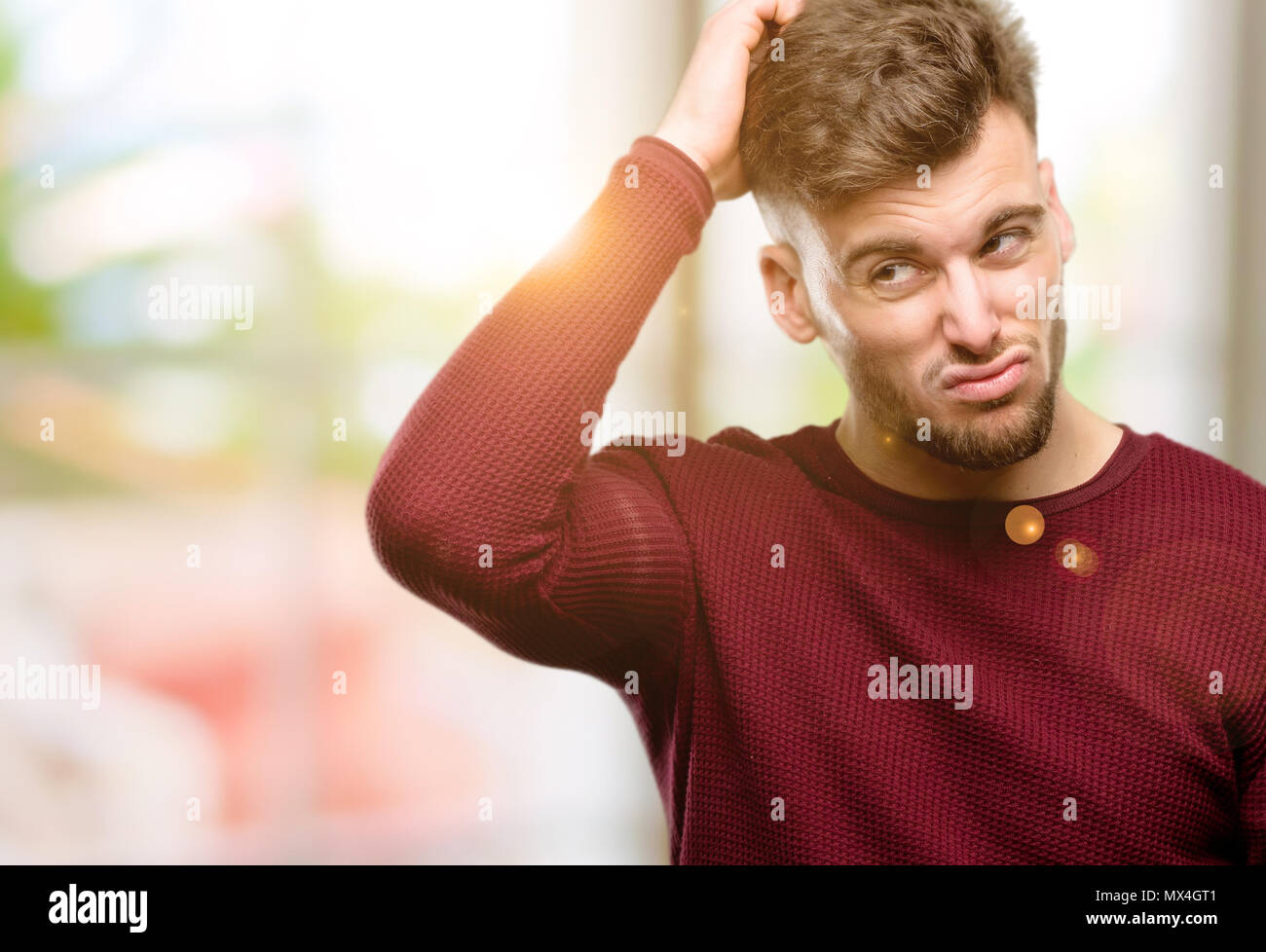 Handsome young man doubt expression, confuse and wonder concept ...