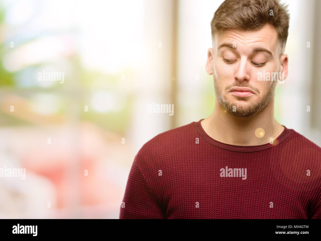 Handsome young man having skeptical and dissatisfied look expressing ...