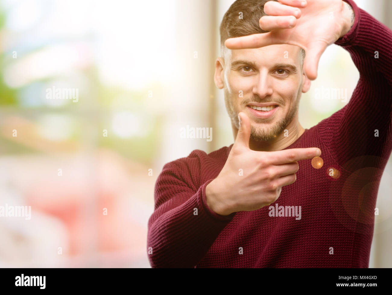 Handsome young man confident and happy showing hands to camera ...