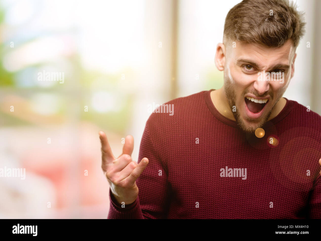 Young man making rock hi-res stock photography and images - Alamy
