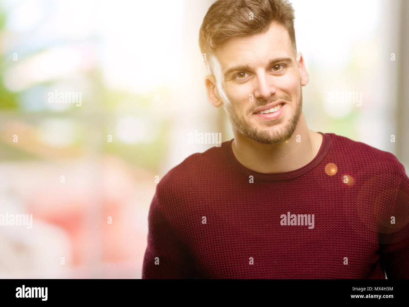 Handsome young man confident and happy with a big natural smile ...