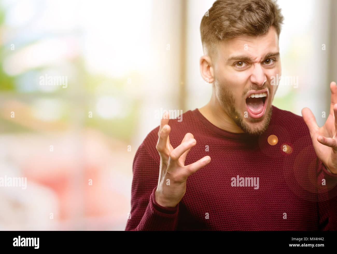Handsome young man terrified and nervous expressing anxiety and panic ...