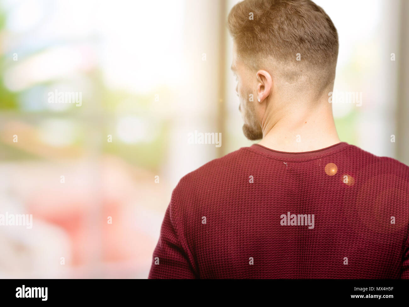 Handsome young man backside, rear view Stock Photo - Alamy