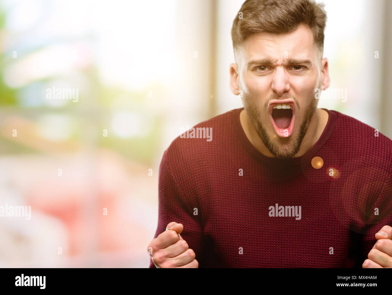 Handsome young man happy and excited celebrating victory expressing big ...