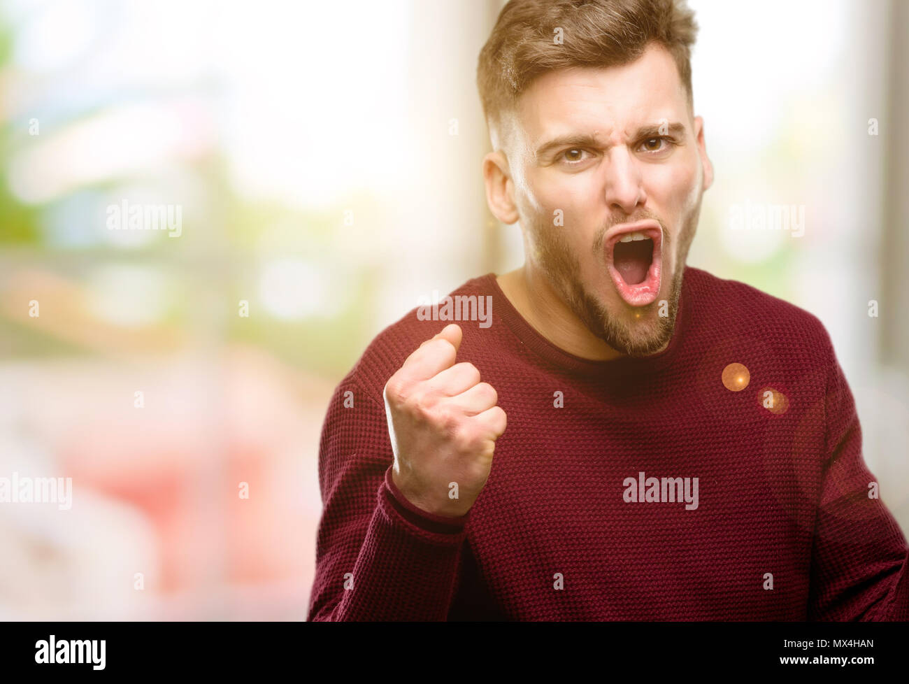 Handsome young man happy and excited celebrating victory expressing big ...