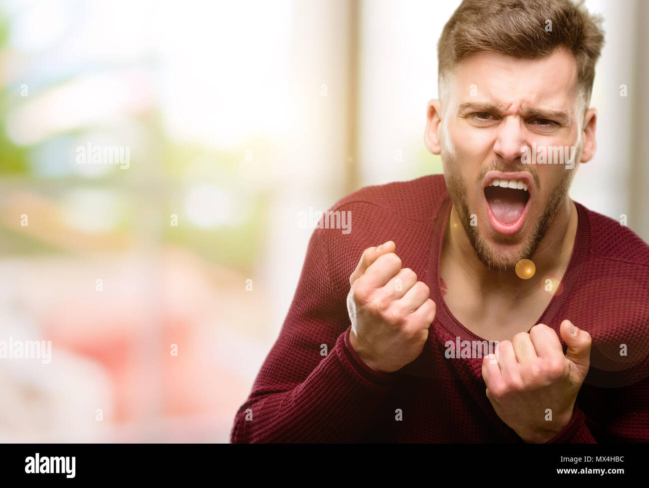 Handsome young man happy and excited celebrating victory expressing big ...