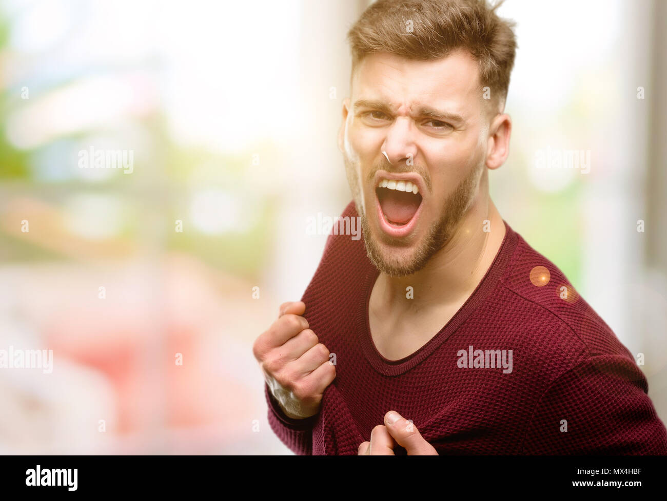 Handsome young man happy and excited celebrating victory expressing big ...
