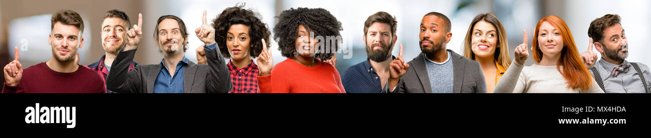 Group of people raising finger, the number one Stock Photo - Alamy