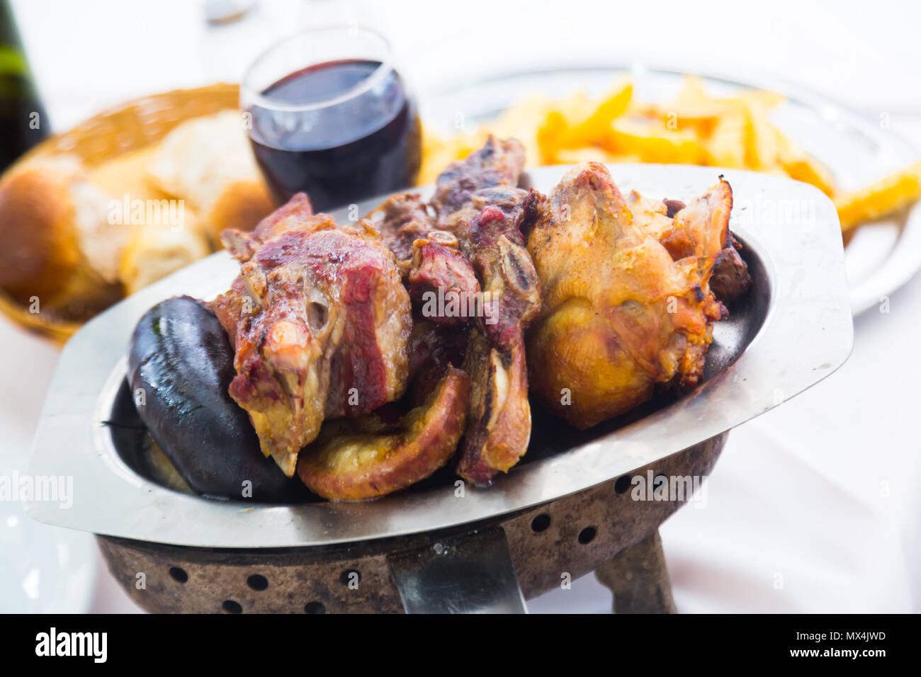 Popular Argentinian dish asado of grilled meats served at dinner Stock ...