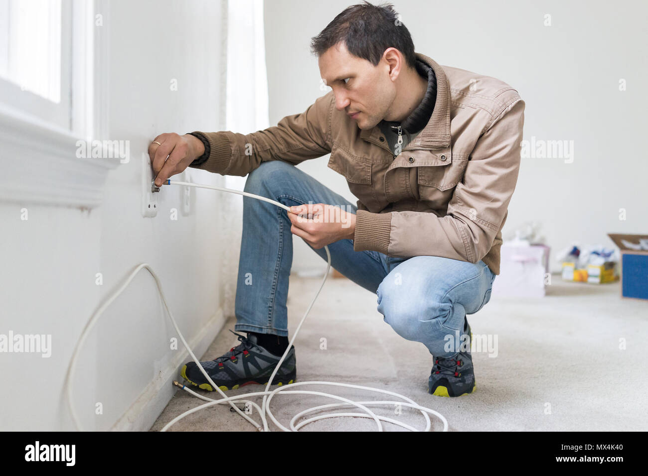Man fixing wire wall hi-res stock photography and images - Alamy